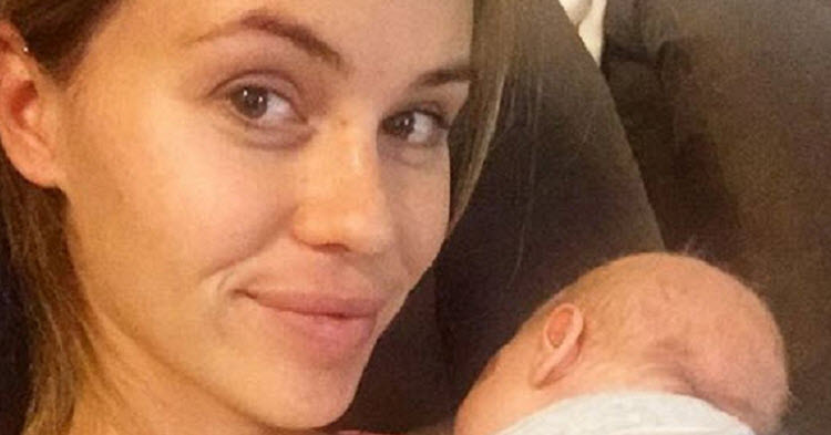 Kelly Cartwright's baby is sick and she's looking tired.